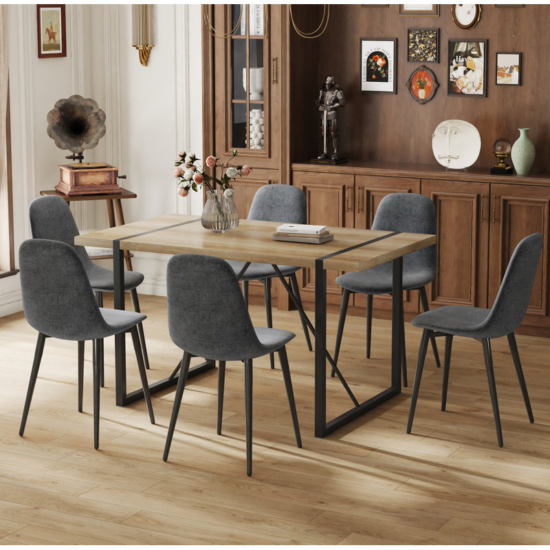 17 Stories 4 dark grey dining chairs and a rustic industrial rectangular wood color MDF dining table Wayfair